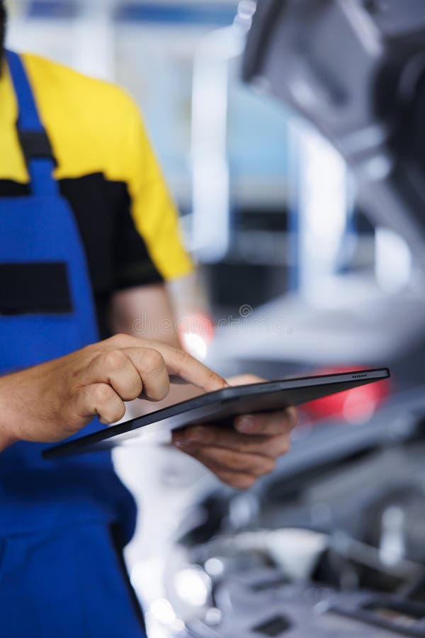 Garage Worker Orders New Car Motor Stock Image - Image of garage ...