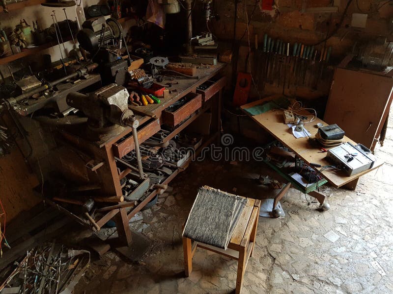 Garage Workshop with Various Machines, Tools and Chair Master in the ...