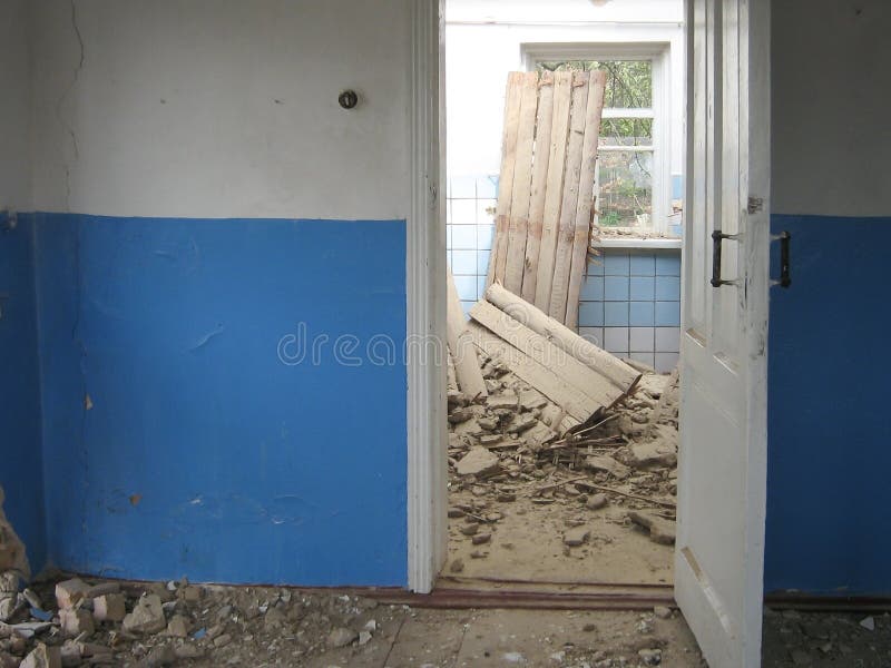 Garbage Behind an Open Door in an Empty Room in an Abandoned House ...