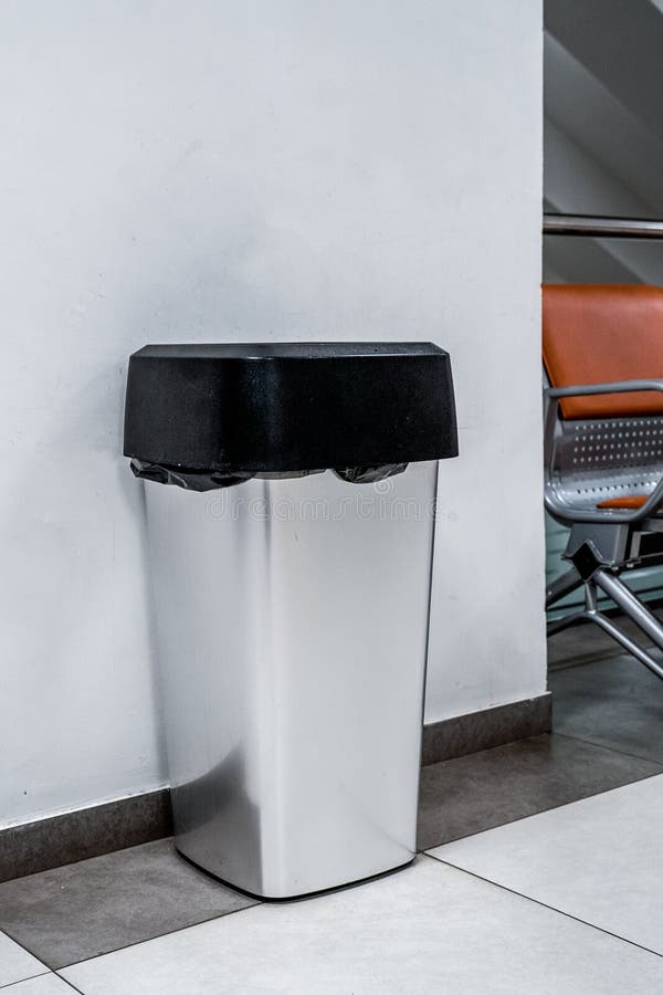 Garbage Bin on the Floor in a Room. Garbage Can in Restroom with Black ...