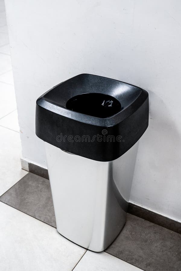 Garbage Bin on the Floor in a Room. Garbage Can in Restroom with Black ...