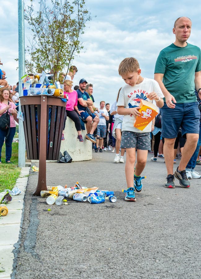 Garbage Bin Full of Trash. Overflowing Garbage Bin with Many People ...