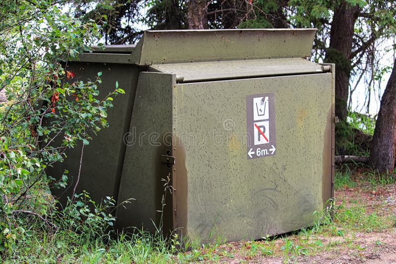 A Garbage Bin with a No Parking in-front Sign Stock Photo - Image of ...