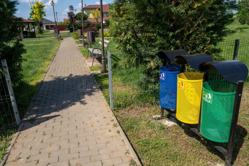 Garbage Bin in the Park, Blue, Yellow, Green Stock Photo - Image of ...