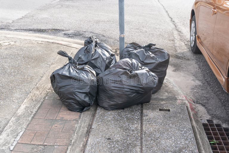 Garbage in Black Garbage Bag in Stack at Garbage Dump on Footpath Taken ...