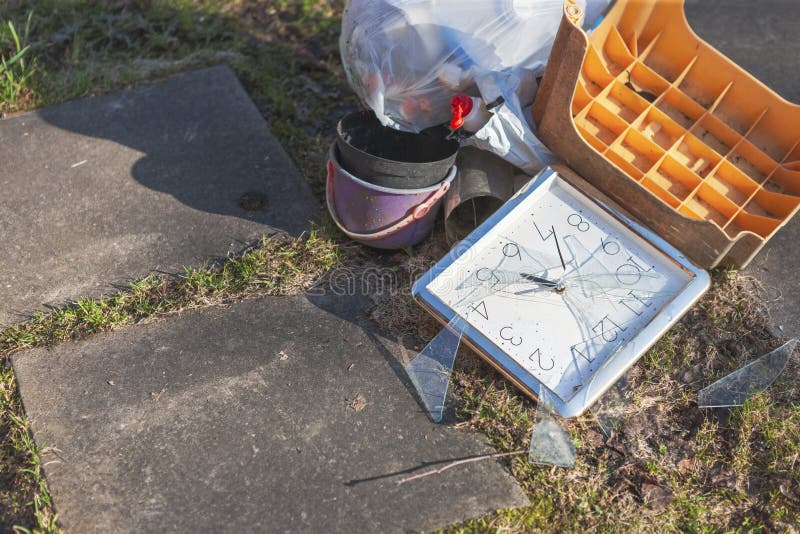 Garbage and broken clock stock image. Image of smashed - 246279061