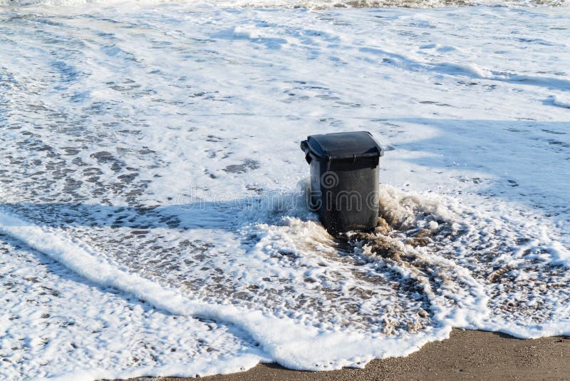 Garbage Can in the Tidal Wave Stock Photo - Image of flooded, sand ...