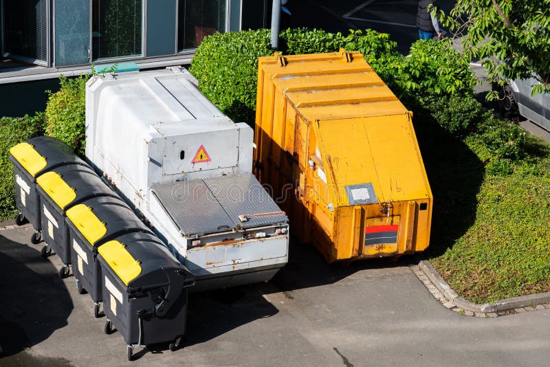 Garbage Cans and Large Containers Standing in the Yard of the House ...