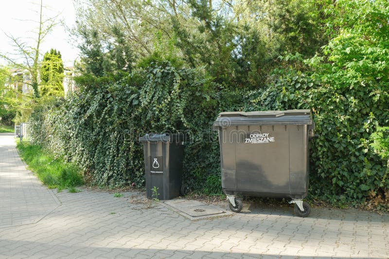Garbage Cans Stand on the Street Stock Photo - Image of pollution, city ...