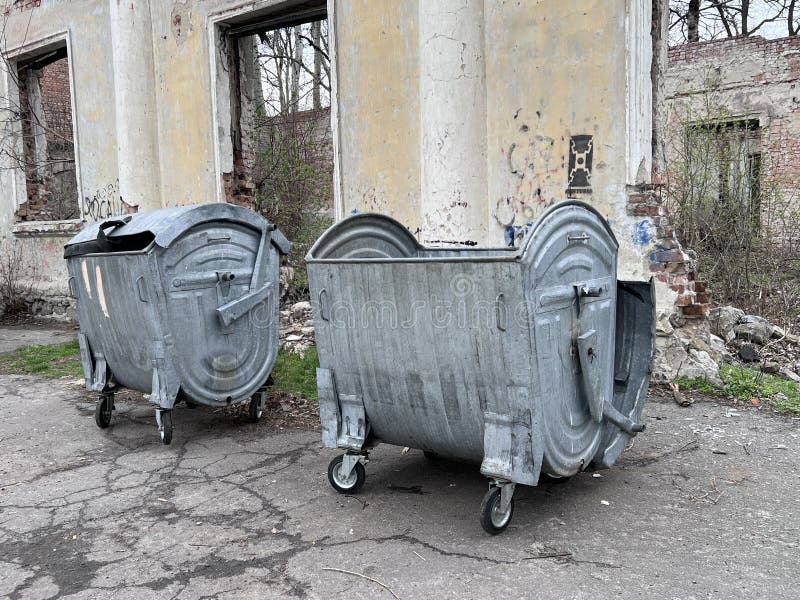 Garbage Cans Standing Near an Old Abandoned Building Stock Photo ...