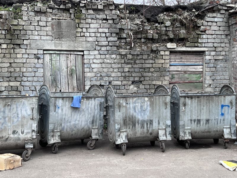 Garbage Cans Standing in the Yard Near Brick Wall Stock Image - Image ...