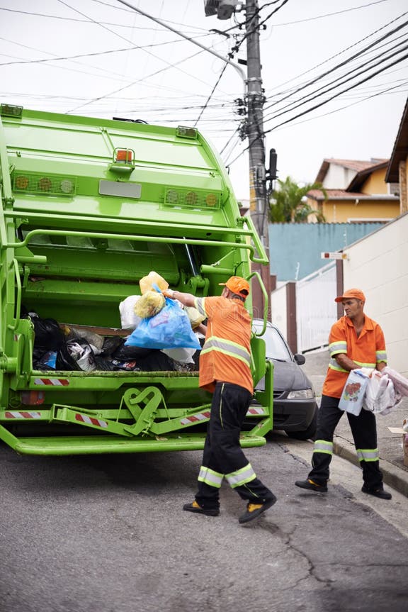 Garbage Collection Day Again. a Garbage Collection Team at Work. Stock ...