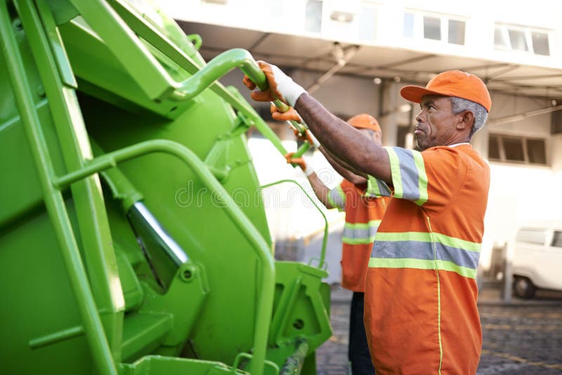 Garbage Collection Day. a Garbage Collection Team at Work. Stock Photo ...