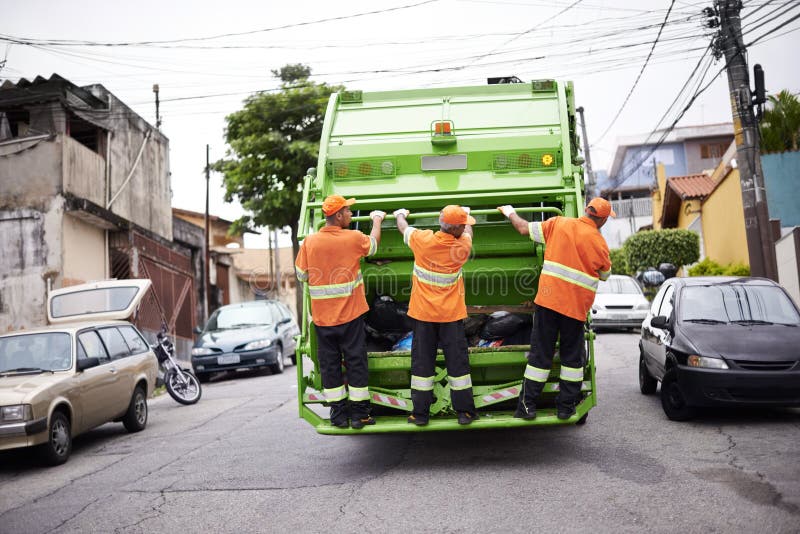 Garbage Collection Day. a Garbage Collection Team at Work. Stock Photo ...