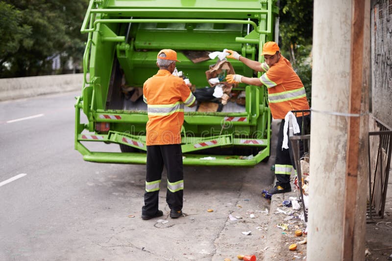Garbage Collection Day. a Garbage Collection Team at Work. Stock Photo ...