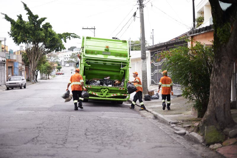 Garbage Collection Day. a Garbage Collection Team at Work. Stock Photo ...