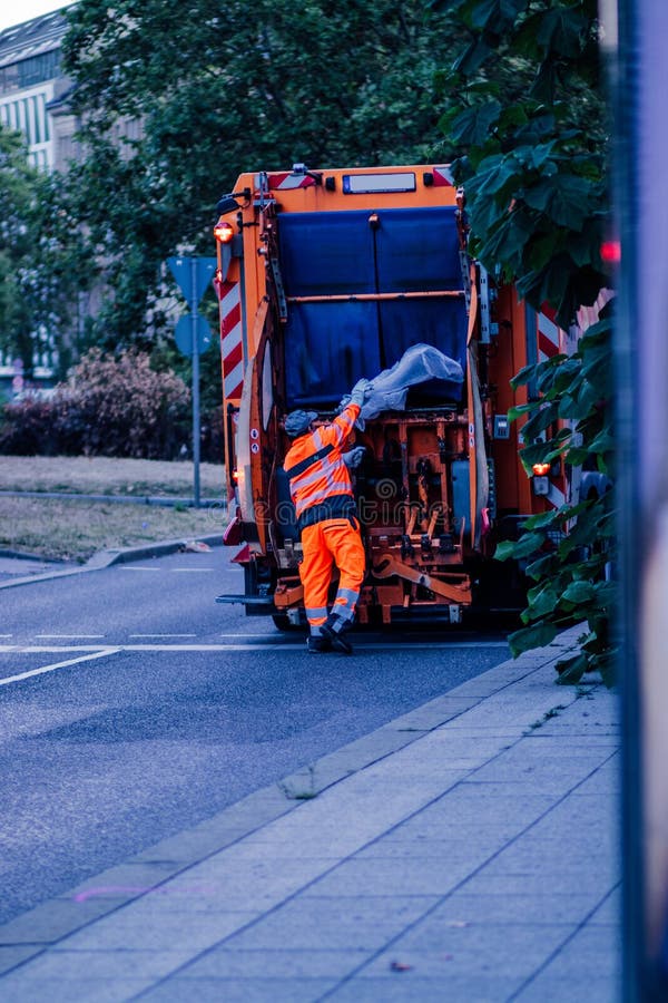 Garbage Worker Loading Garbage into a Truck Editorial Stock Image ...