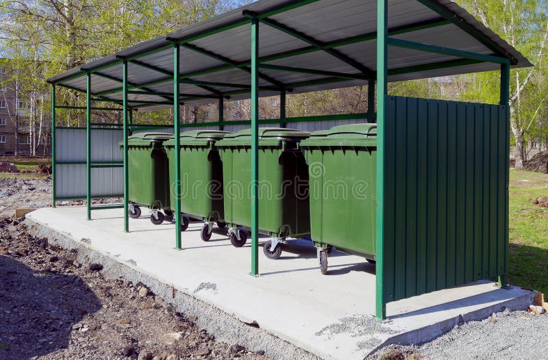 Garbage Containers. Plastic Garbage Containers in the Yard of the House ...