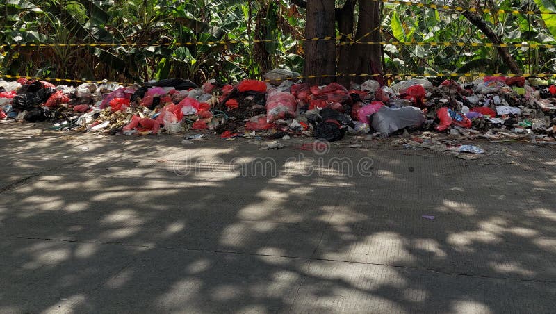 Garbage Disposal Area on the Side of the Road that is Installed with a ...