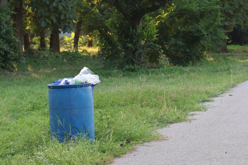 Garbage Disposal Point: Large Blue Garbage Cans Set Up Along the ...