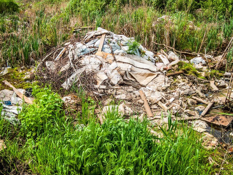 Garbage Dump on the Green Grass Stock Image - Image of junk, grass ...