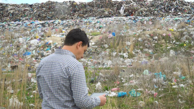 Garbage Dump Inspector Records Pollution Level on City Dump. Ecology ...