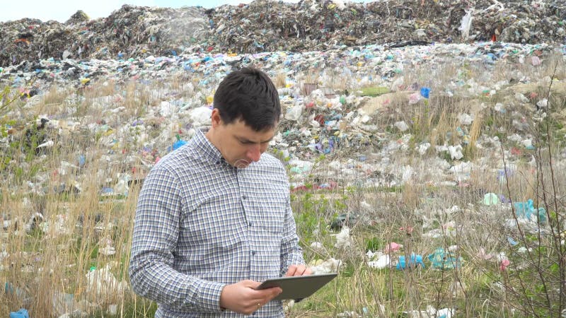 Garbage Dump Inspector with Tablet Records Pollution Level. Ecology ...