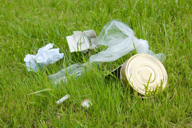 Garbage on the green lawn stock photo. Image of park - 30731470