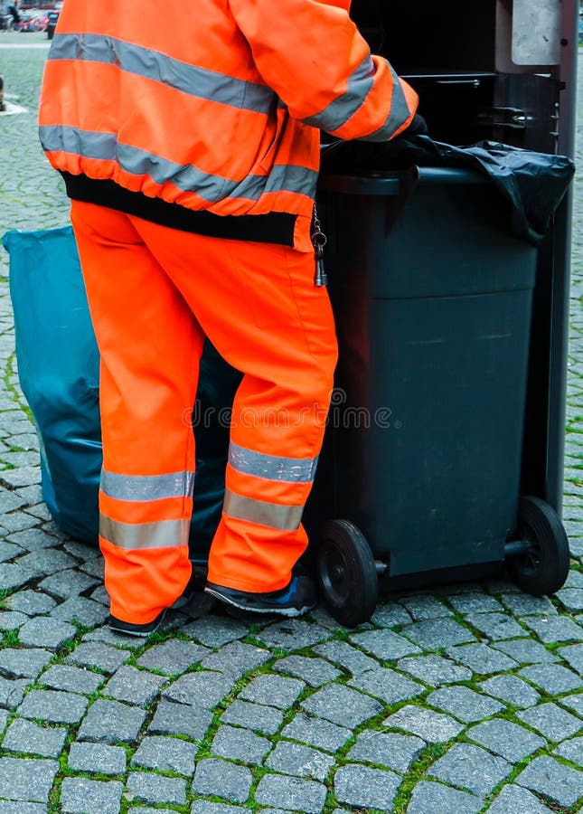Garbage Man Wearing Work Clothes Emptying Garbage Cans Stock Image ...