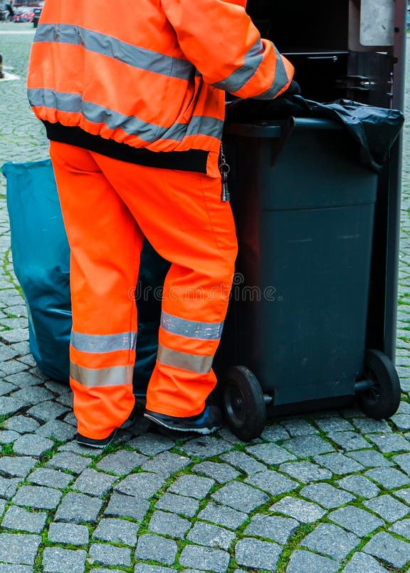Garbage Man Wearing Work Clothes Emptying Garbage Cans Stock Image ...