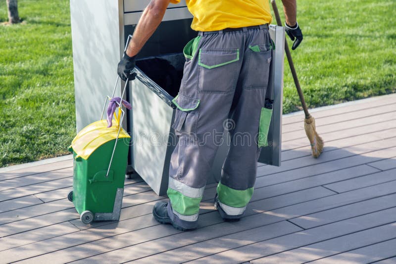 Garbage Men Emptying Trash Bin Stock Image - Image of male, plastic ...