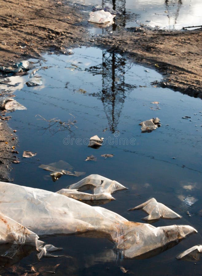 Garbage in the Mud on the Dirt Road Stock Photo - Image of dirty ...