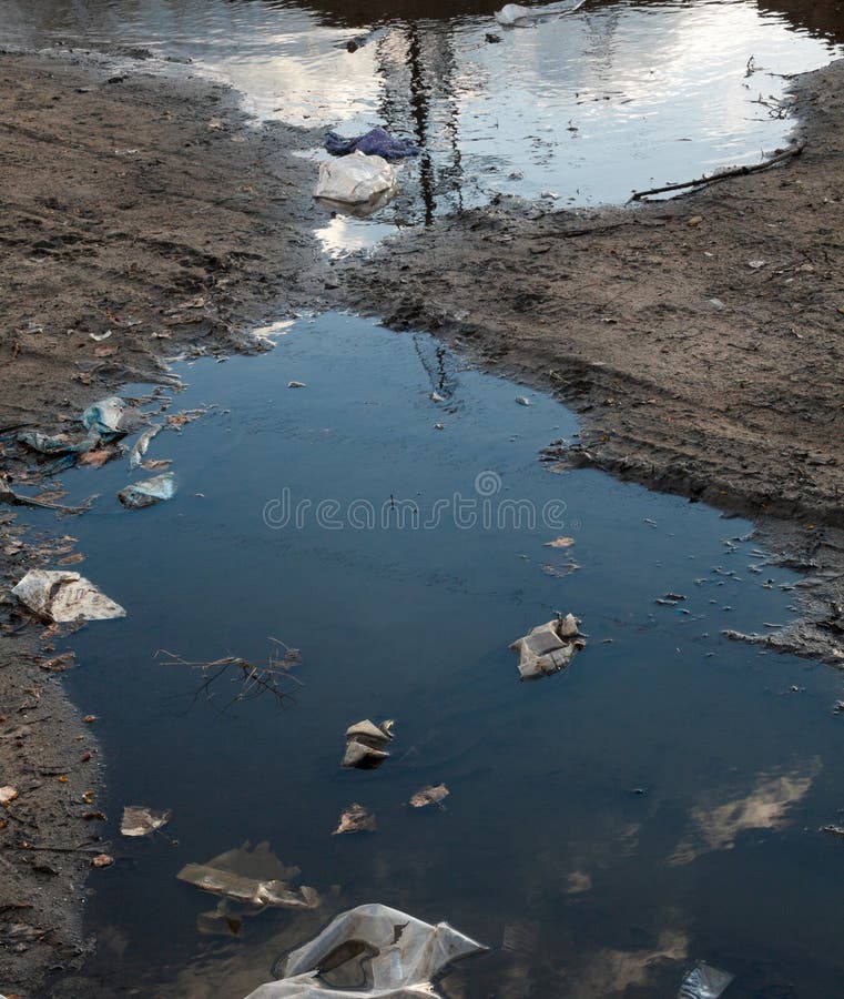 Garbage in the Mud on the Dirt Road Stock Image - Image of junk, ground ...
