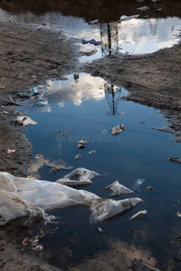 Garbage in the Mud on the Dirt Road Stock Photo - Image of pollution ...