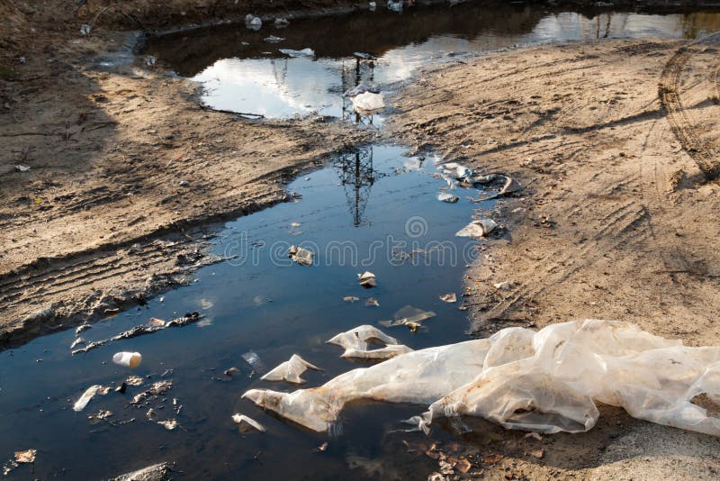 Garbage in the Mud on the Dirt Road Stock Photo - Image of land ...
