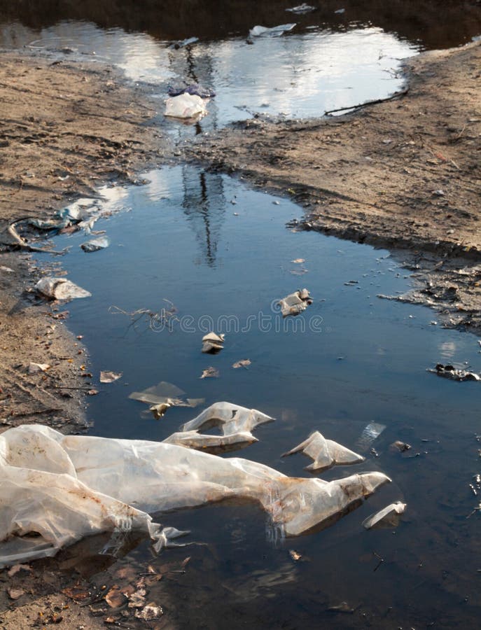 Garbage in the Mud on the Dirt Road Stock Image - Image of polyethylene ...