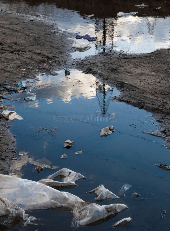 Garbage in the Mud on the Dirt Road Stock Image - Image of messy ...