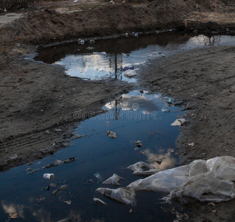 Garbage in the Mud on the Dirt Road Stock Photo - Image of land ...