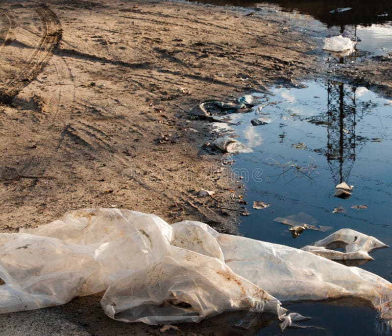 Garbage in the Mud on the Dirt Road Stock Photo - Image of pollution ...