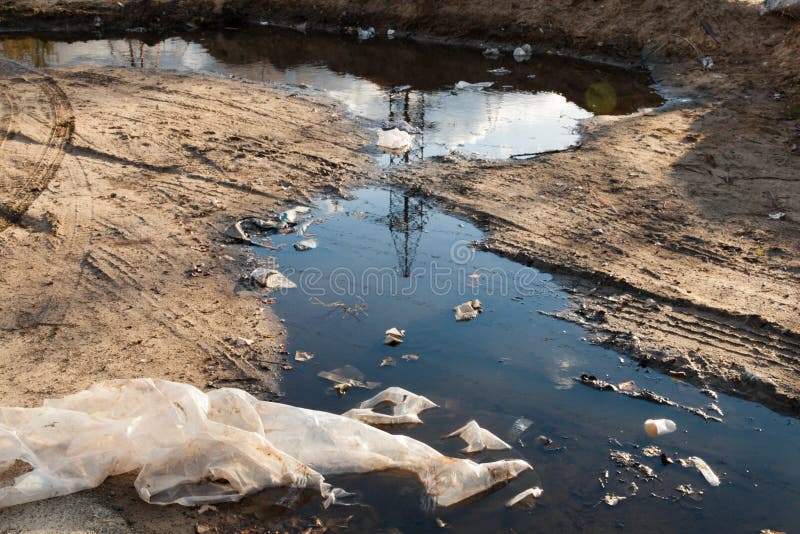 Garbage in the Mud on the Dirt Road Stock Image - Image of messy ...