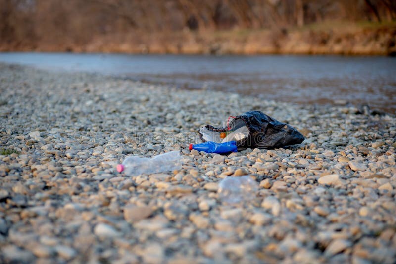Garbage Near the River. Environmental Pollution Shore Stock Photo ...