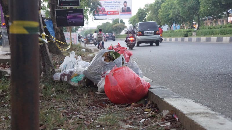 Garbage Plastic Bag at Roadside Editorial Photo - Image of street ...