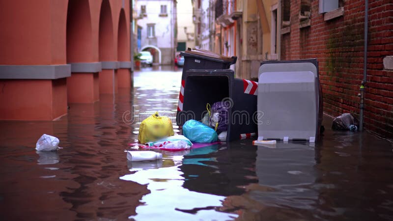 Garbage and Plastic Trash Cans Float on Water after Flood Stock Footage ...