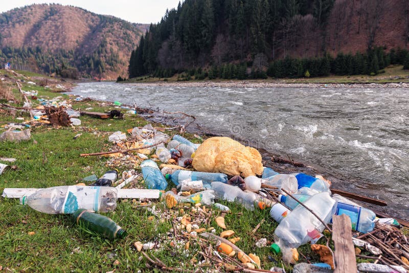 Garbage on the river bank stock image. Image of nature - 116264353
