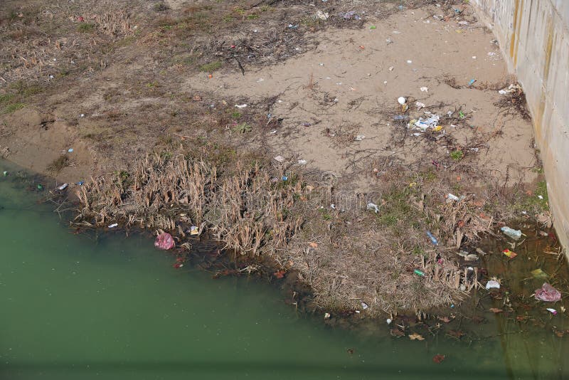 Garbage in the River. Environmental Pollution. Plastic Bottles, Bags ...