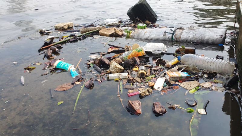 Garbage in the River, Floating Garbage Causes Water Pollution. Stock ...