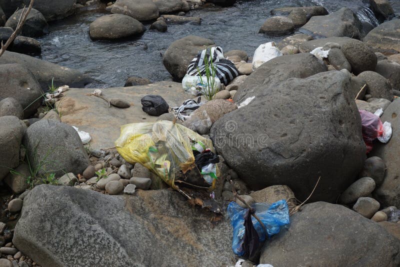The Garbage in the River with Rock Background Editorial Photography ...