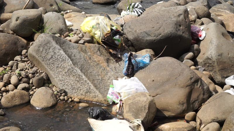 The Garbage in the River with Rock Background Stock Video - Video of ...