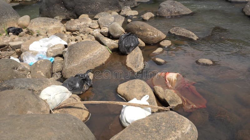 The Garbage in the River with Rock Background Stock Video - Video of ...