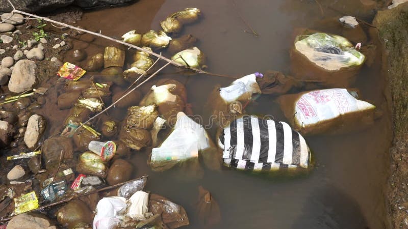 The Garbage in the River with Rock Background Stock Video - Video of ...